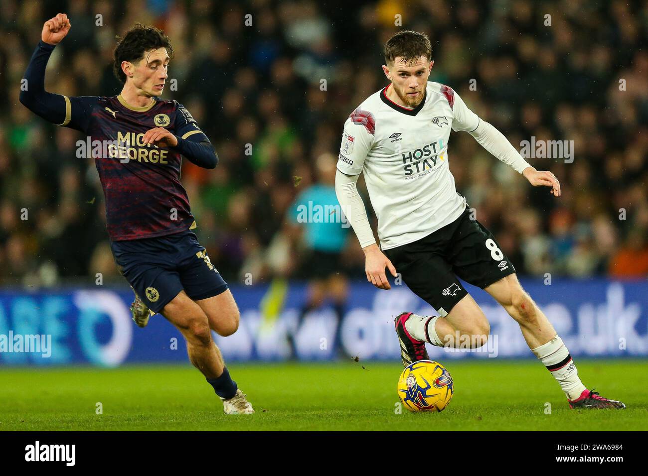 Derby County's Max Bird (right) and Peterborough United's Joe Randall ...