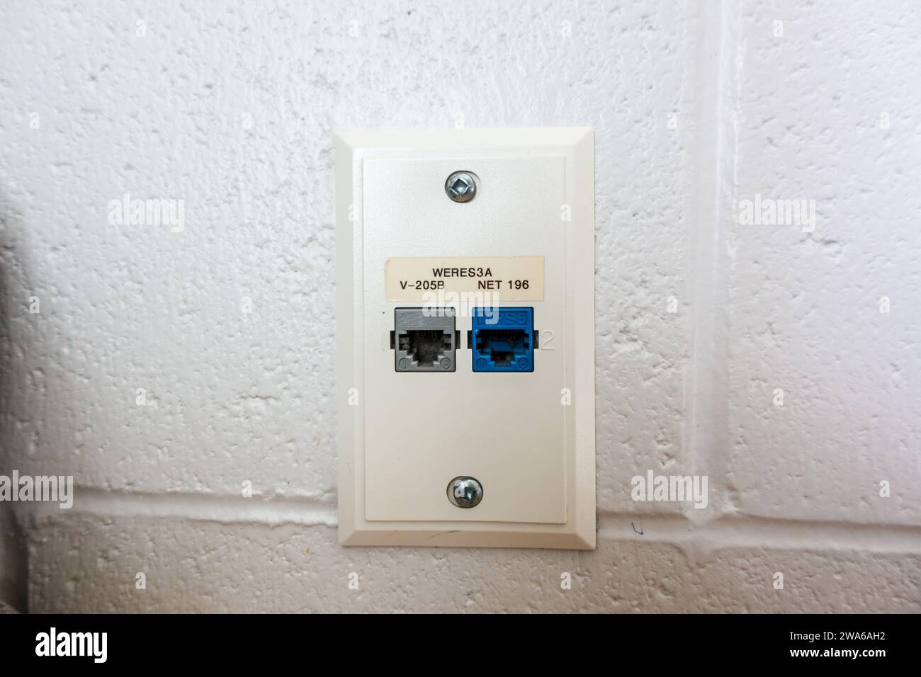 Internet LAN Local Access Network cable plug in point on wall Stock ...