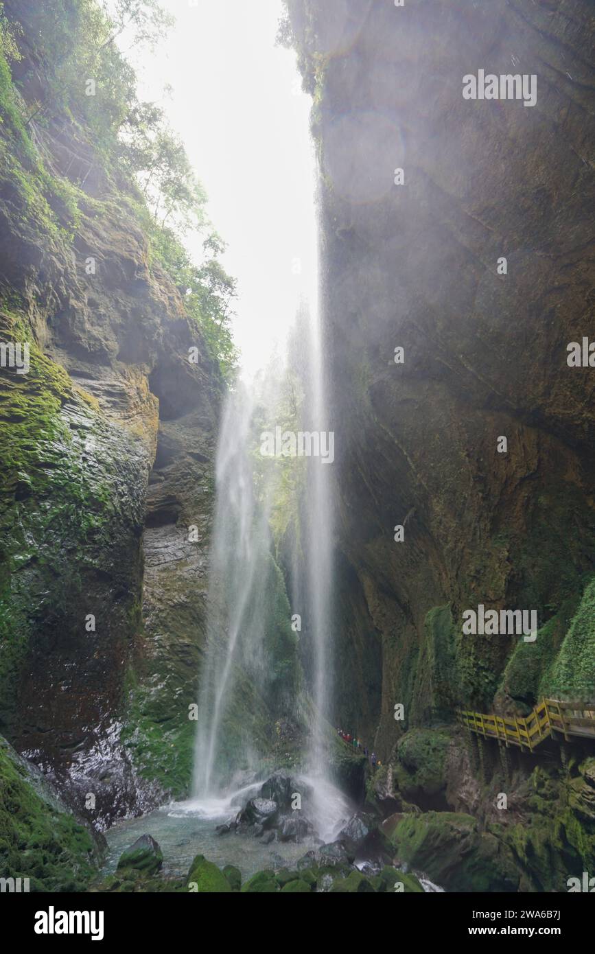 Waterfalls in the canyon fall from the sky. Like a silver-white chain ...