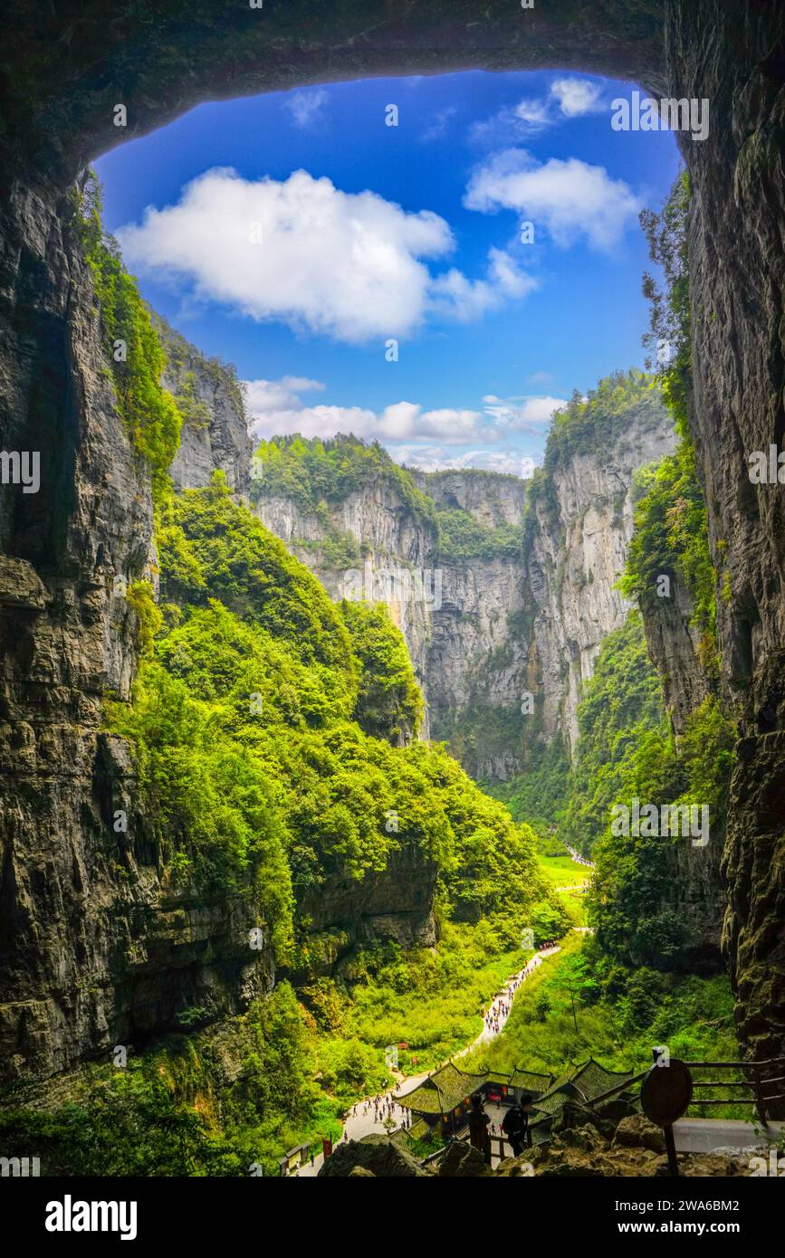 The sky is a natural opening in the roof of the rock pit. Lush green ...