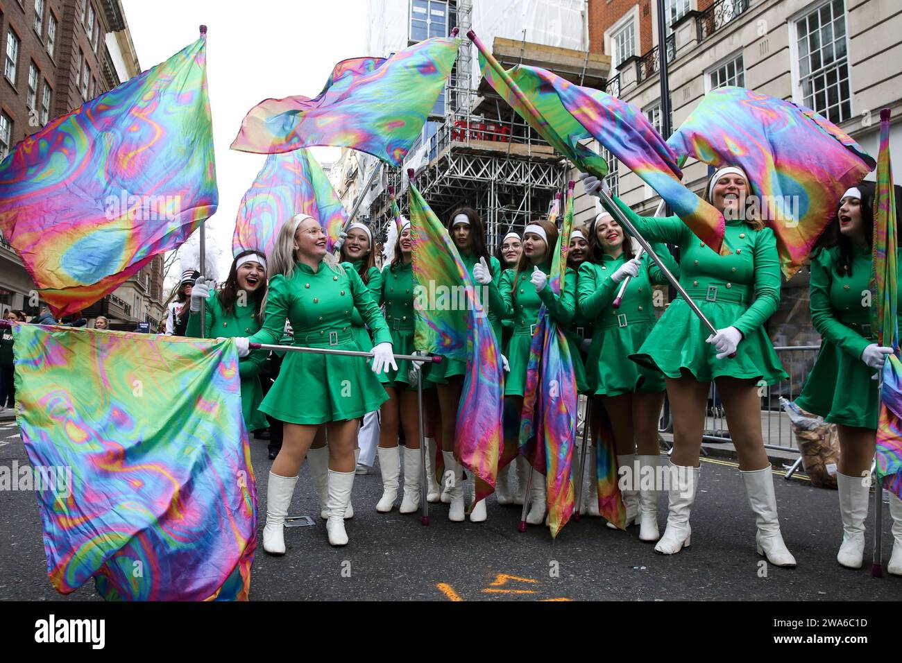 London, UK. 01st Jan, 2024. Performers waving large coloured flags take part in the annual ...