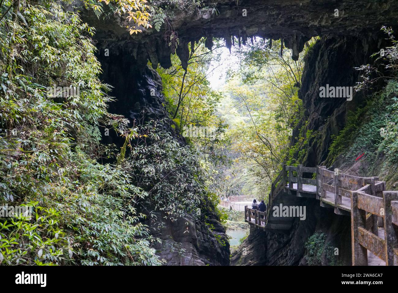 There is a tourist trail and a pool between two large rocks. The Three ...