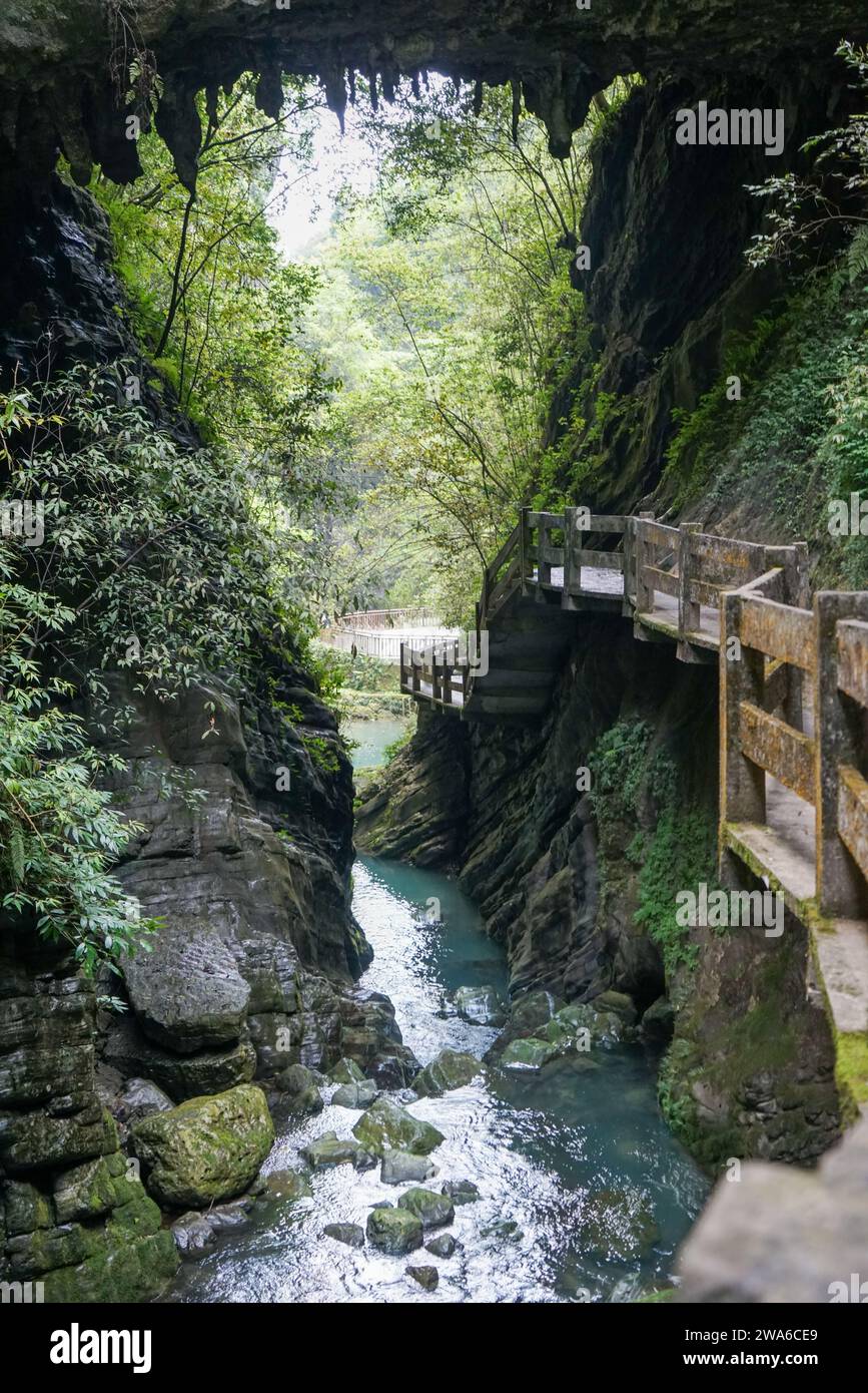 There is a tourist trail and a pool between two large rocks. The Three ...