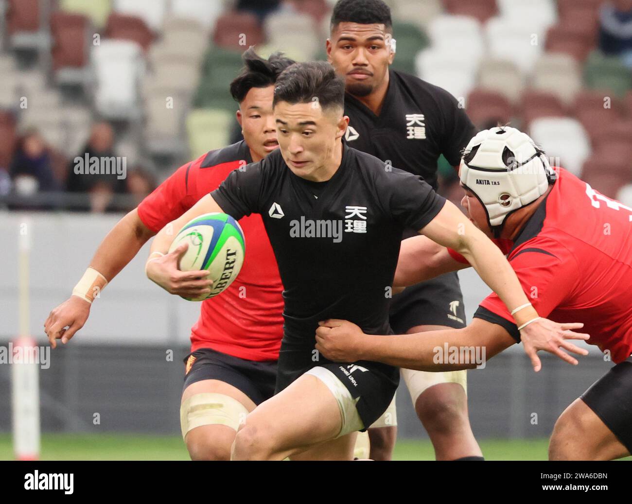 Tokyo, Japan. 2nd Jan, 2024. Tenri University scrum half Takuro Hojo ...