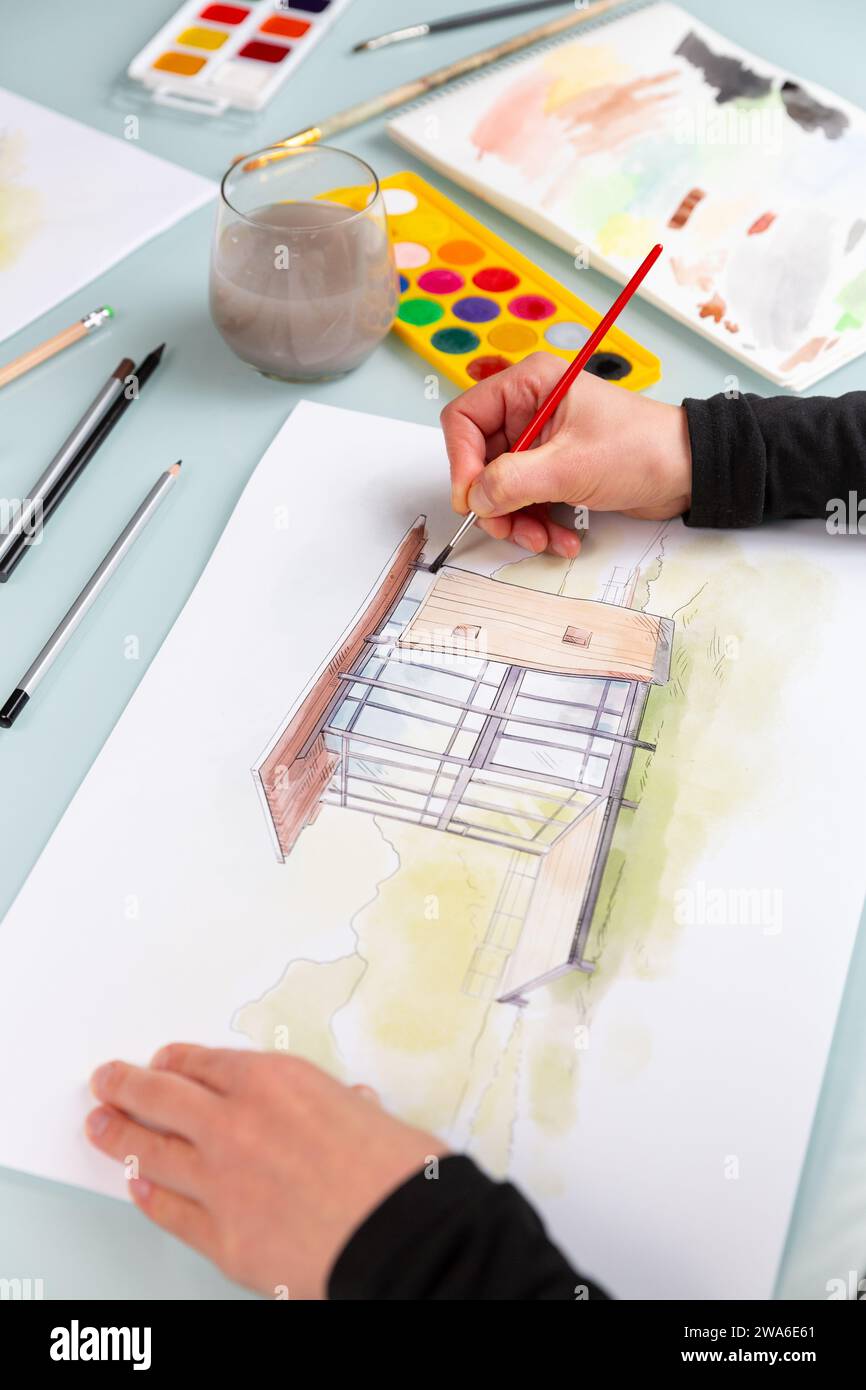Architect illustrator working on hand drawn illustration of a modular ...