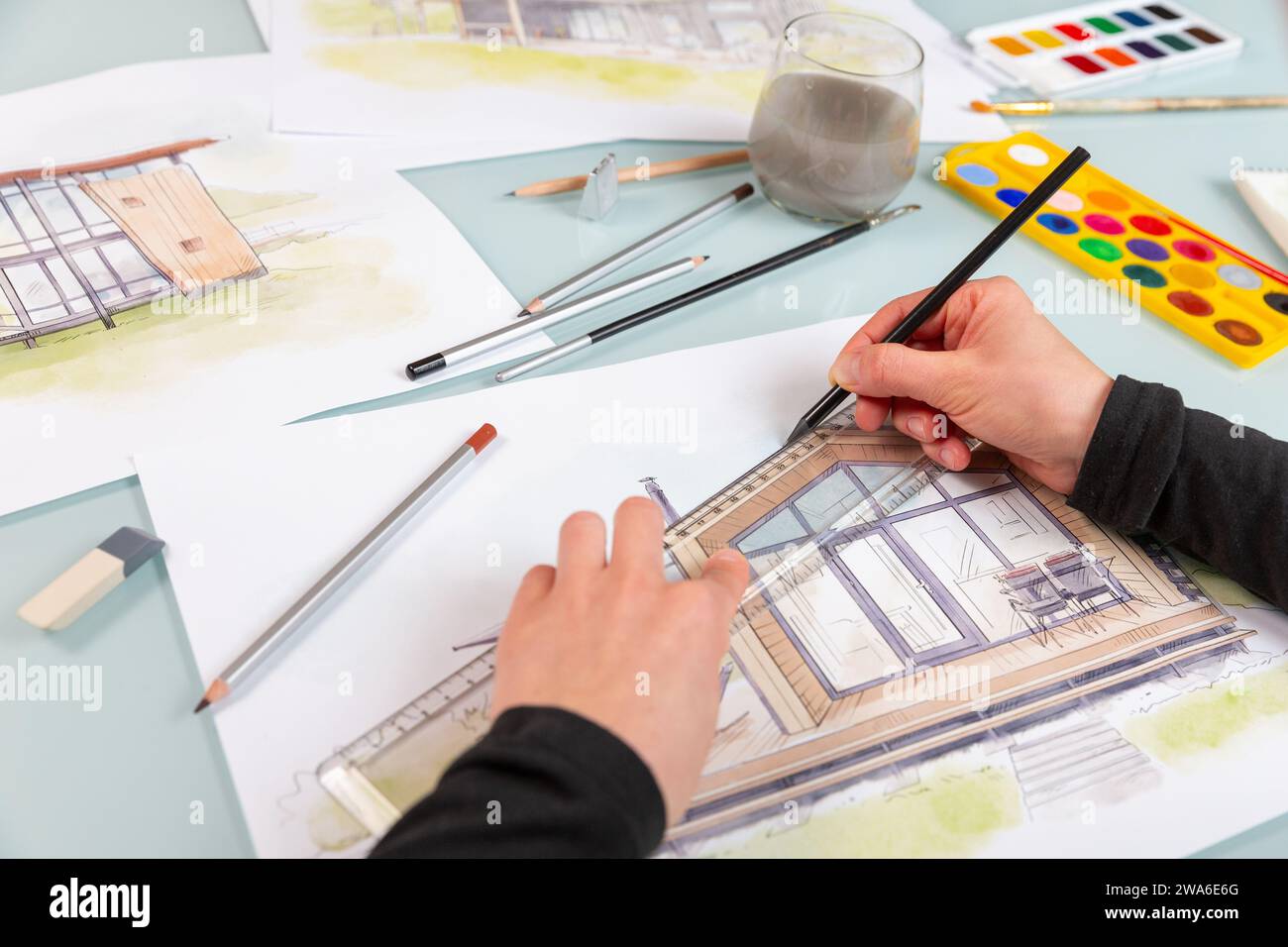 Architect illustrator working on hand drawn illustration of a modular ...