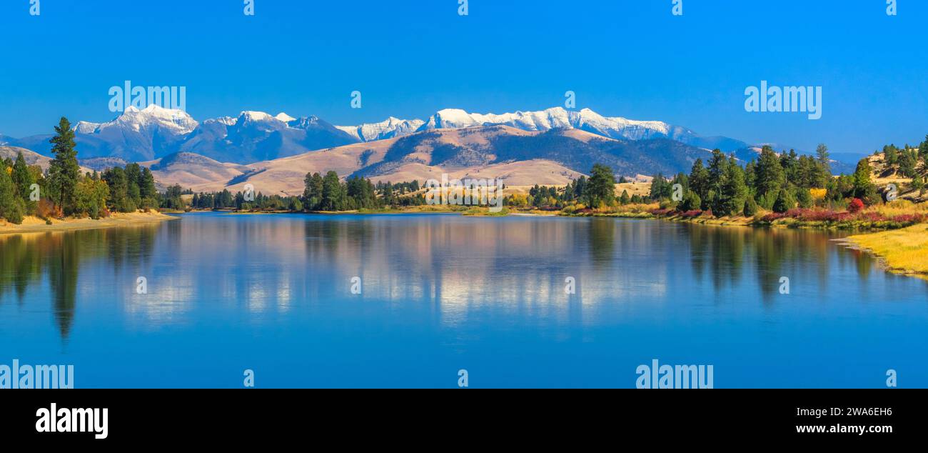 panorama of the flathead river in autumn below the mission mountains ...