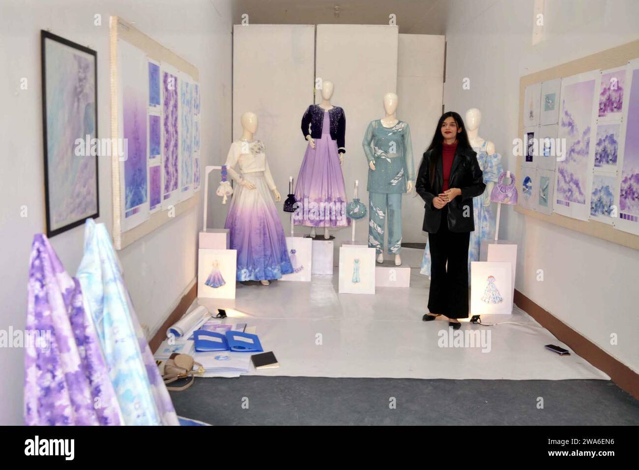 Visitors take keen interest at a stall during the18th Degree Show ...