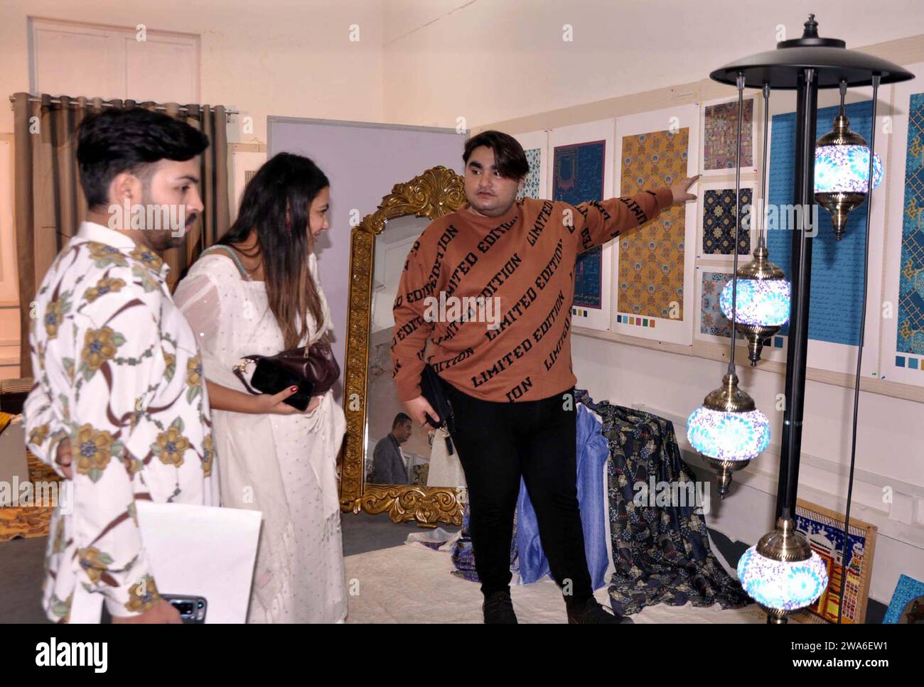 Visitors take keen interest at a stall during the18th Degree Show ...