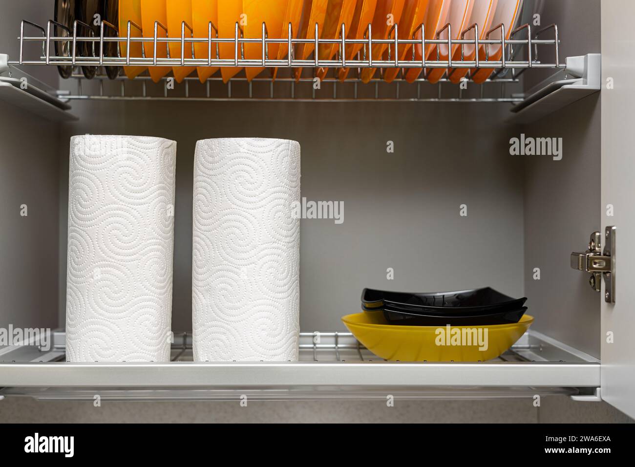 open kitchen cabinet filled with kitchen utensils. kitchen cabinet with ...