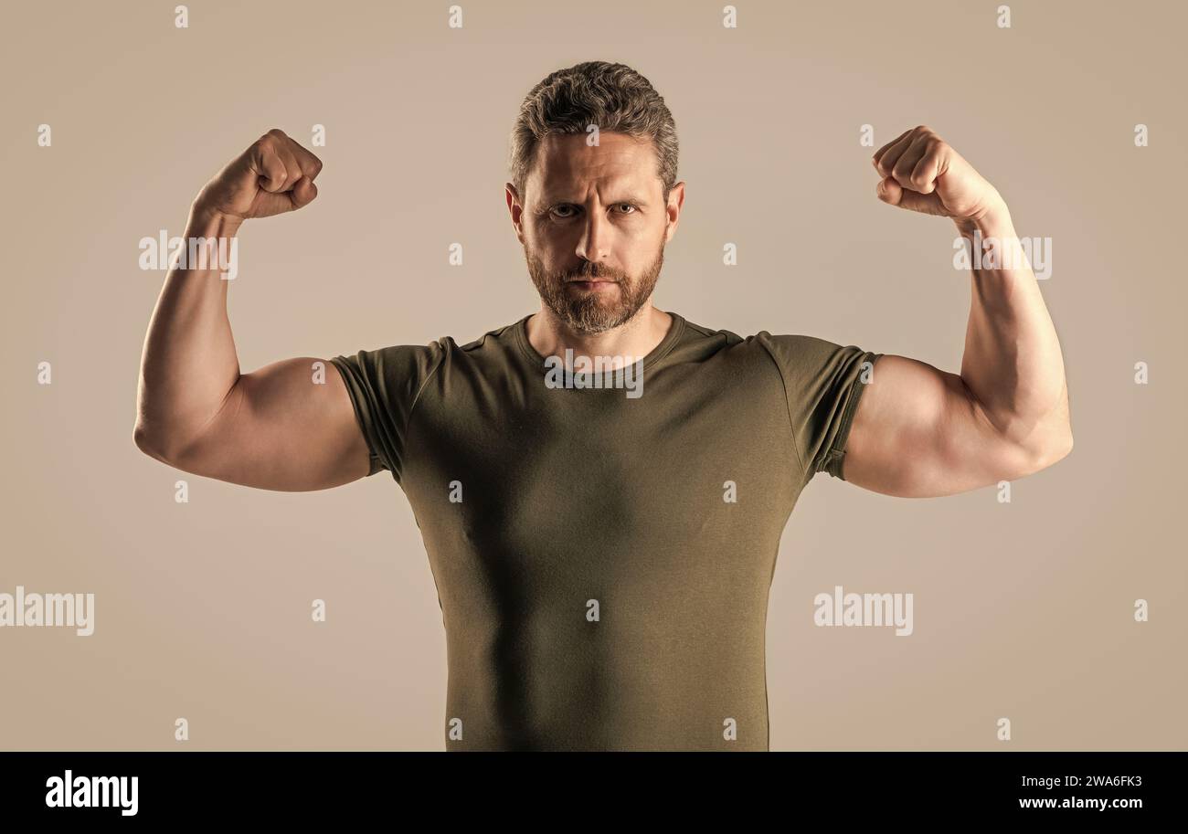 muscular strong man in studio. photo of strong muscular man with ...