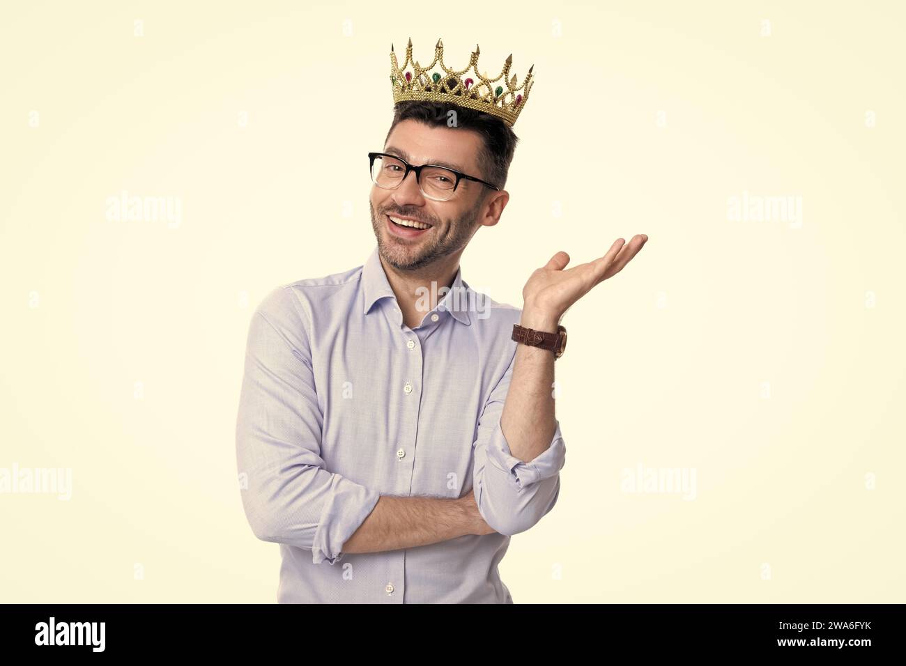 cheerful ceo in crown isolated on white background. crown reward for ...