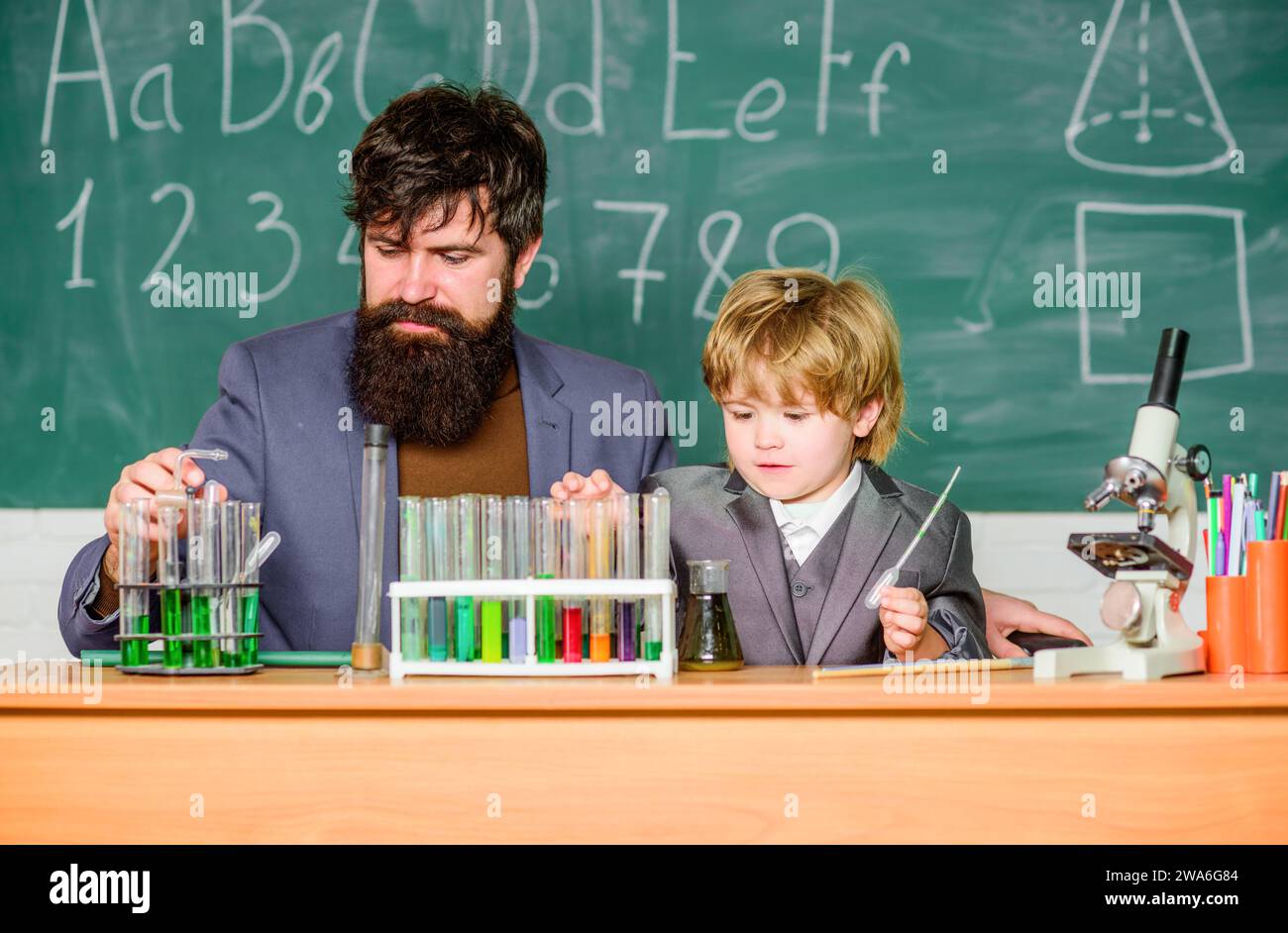 Cognitive process. Back to school. Chemistry experiment. Teacher child ...