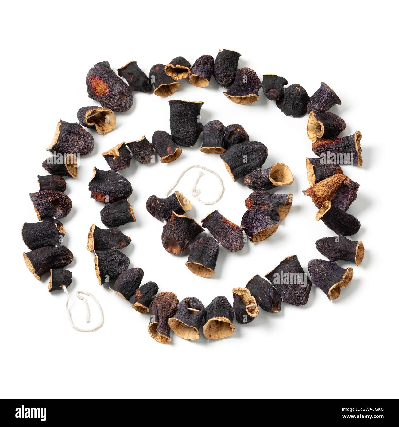 Chain of dried Turkish eggplants isolated on white background close up ...