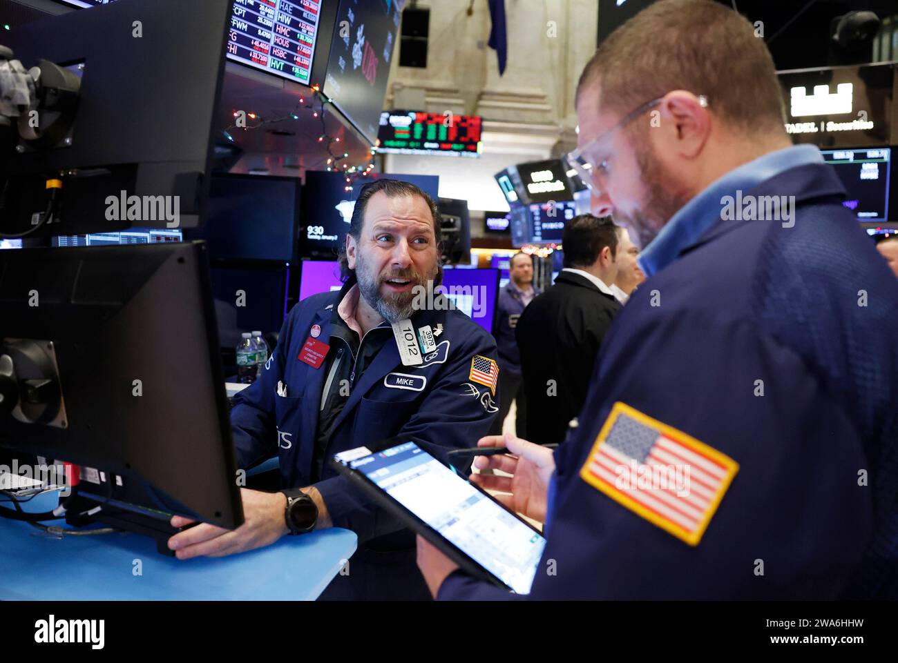 New York, United States. 02nd Jan, 2024. Traders work on the floor of ...