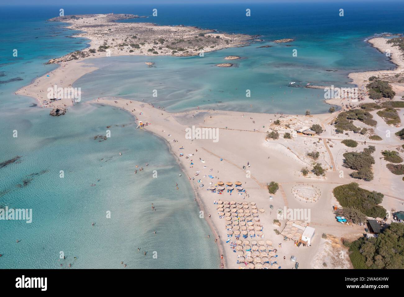 Sandy beach with umbrella in Elafonisi, Crete, Greece. Aerial drone ...