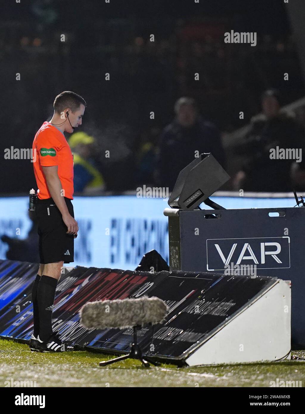 Referee David Munro checks VAR for a possible red card during the cinch ...