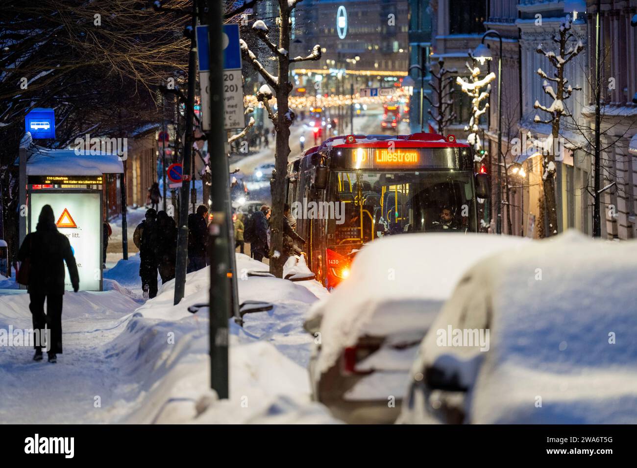 Oslo 20240102.Snow covered cars are parked as the bus to Lillestrom ...