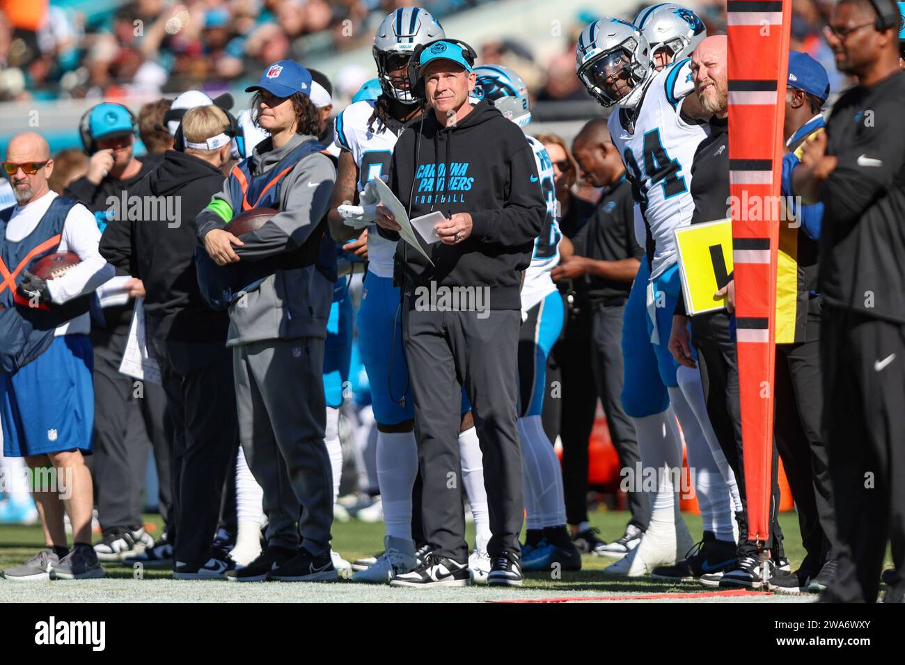 Carolina Panthers interim head coach Chris Tabor looks up at a video ...