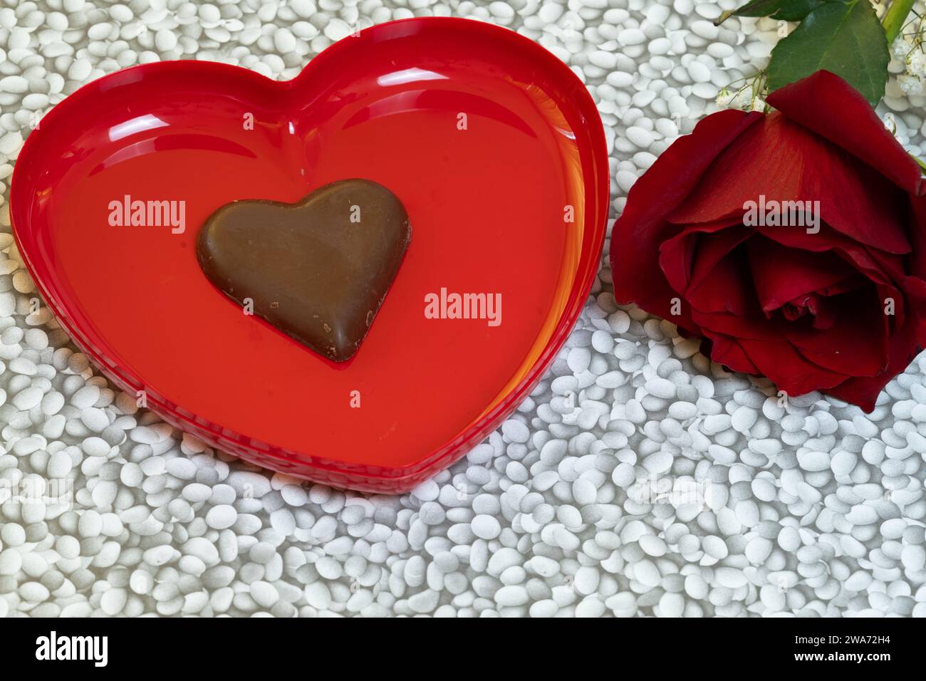 big heart and heart-shaped chocolate, red rose, white rice-like ...