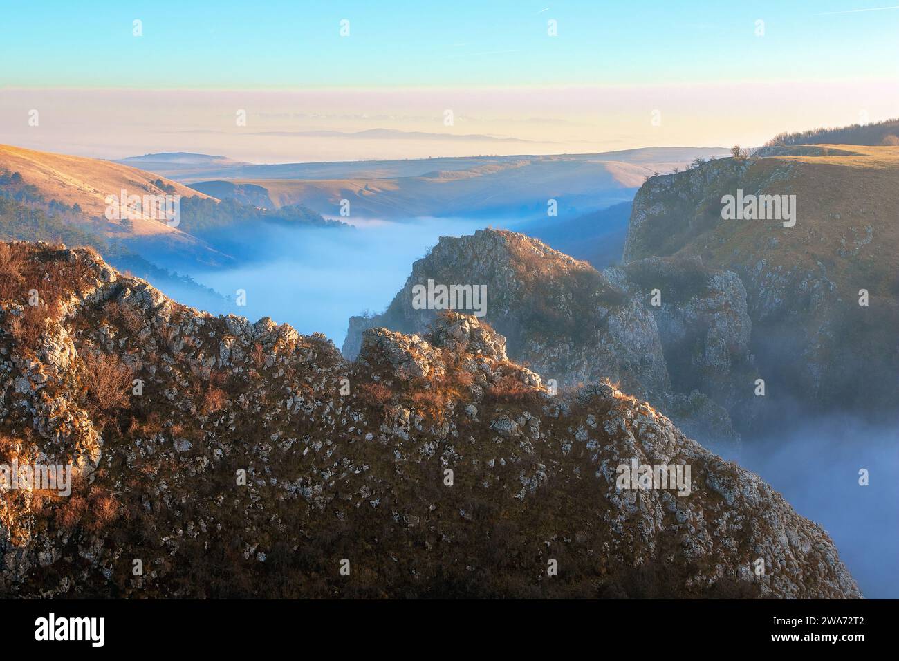 mist over limestone ridge in Tureni gorges, a protected area in ...