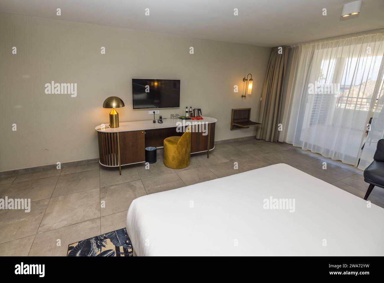 Beautiful interior view of a big luxury hotel room with a table ...