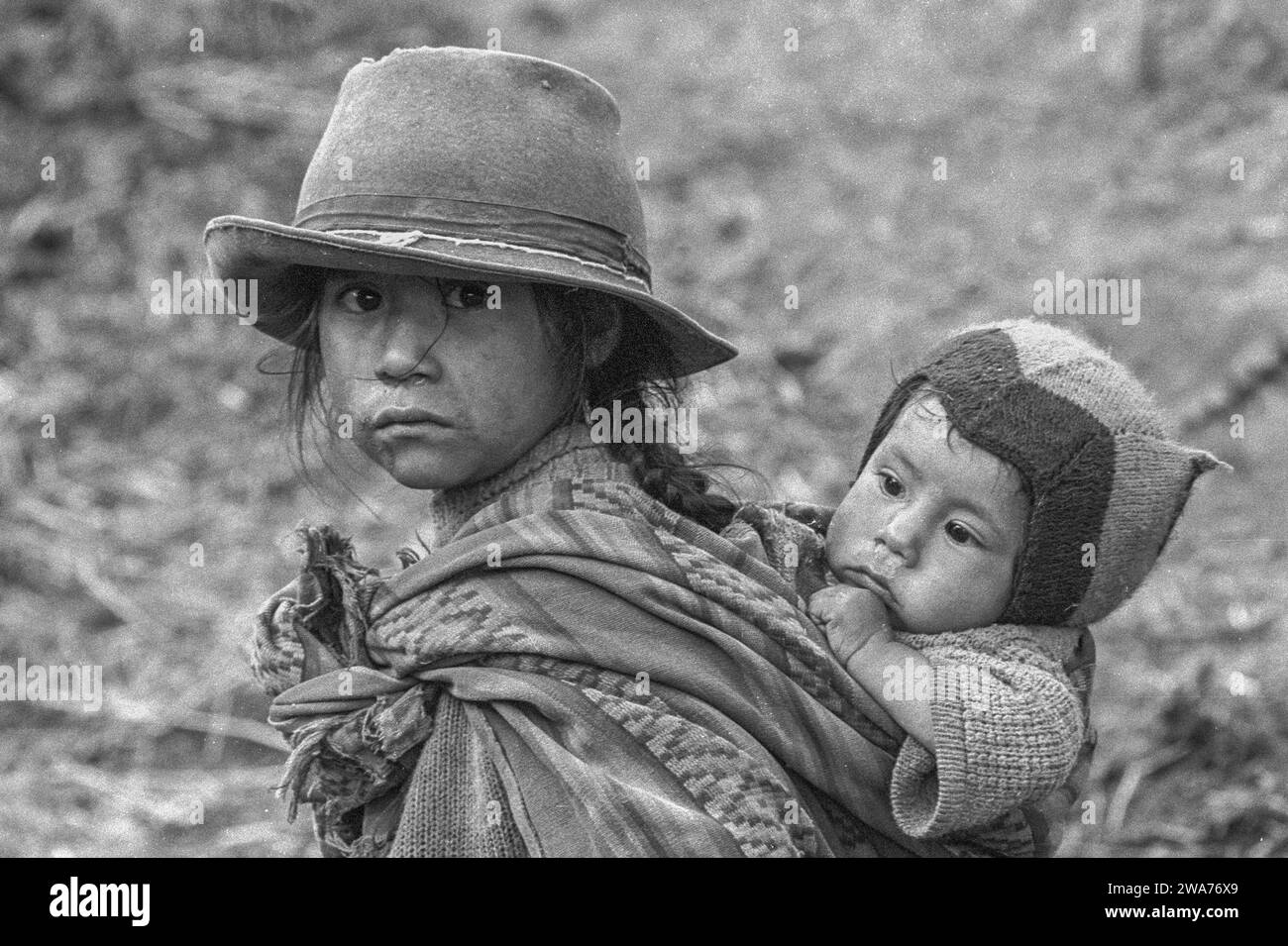 Girl with baby on back Black and White Stock Photos & Images - Alamy