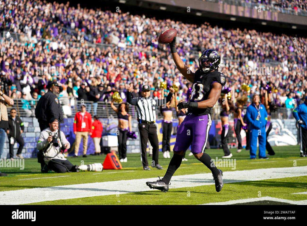 Baltimore Ravens running back Justice Hill in action an NFL football ...