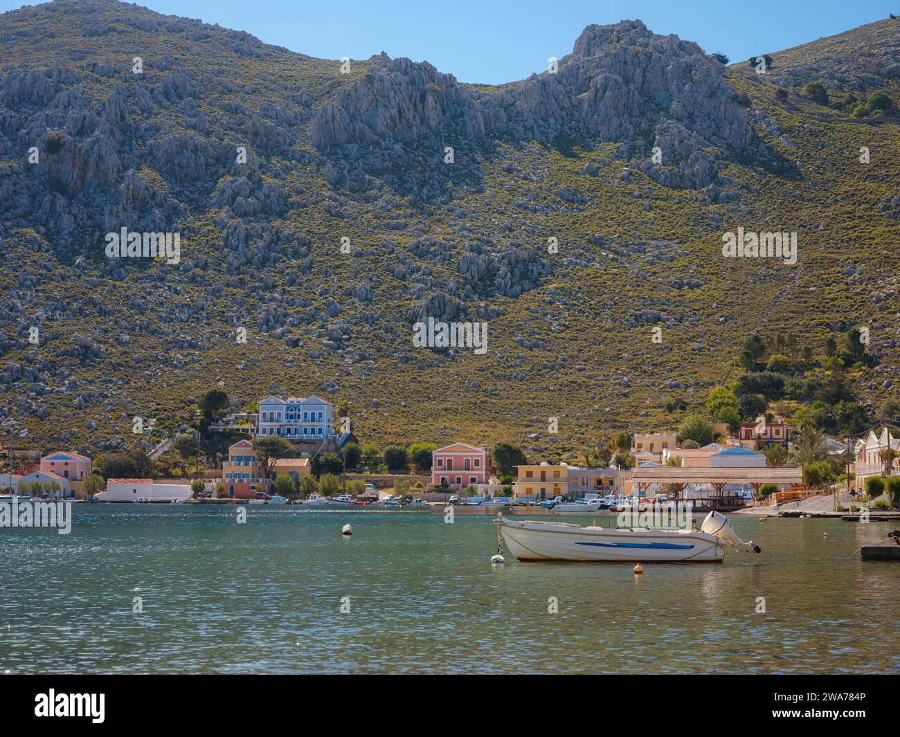 View on Symi or Simi island harbor port, classical ship yachts, houses ...