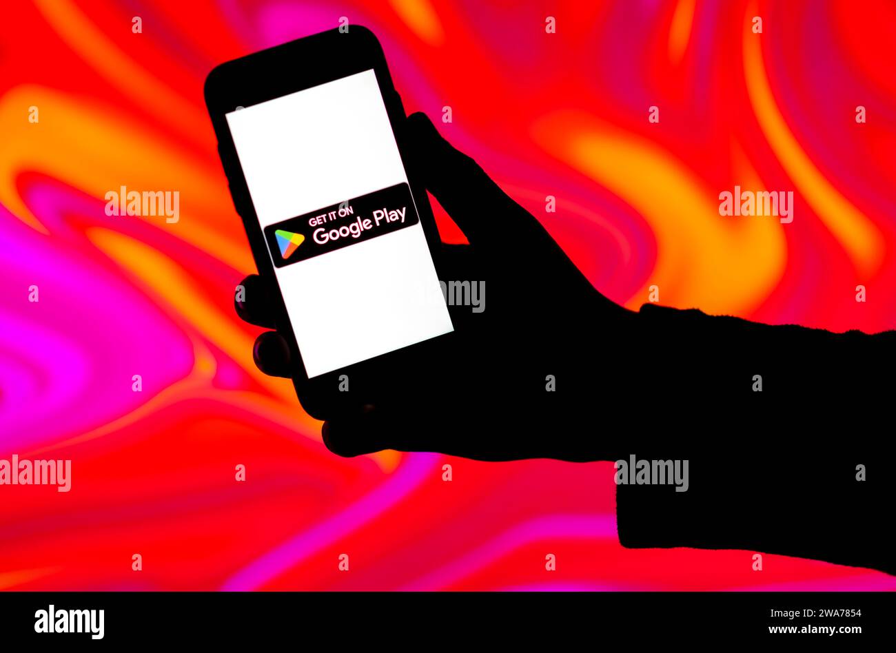 In this photo illustration, the google play logo is seen displayed on a ...