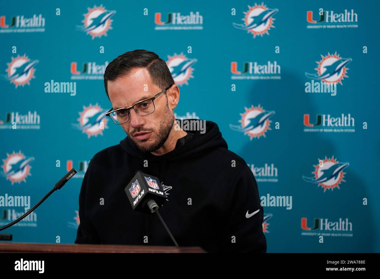 Miami Dolphins head coach Mike McDaniel speaks with members of the ...