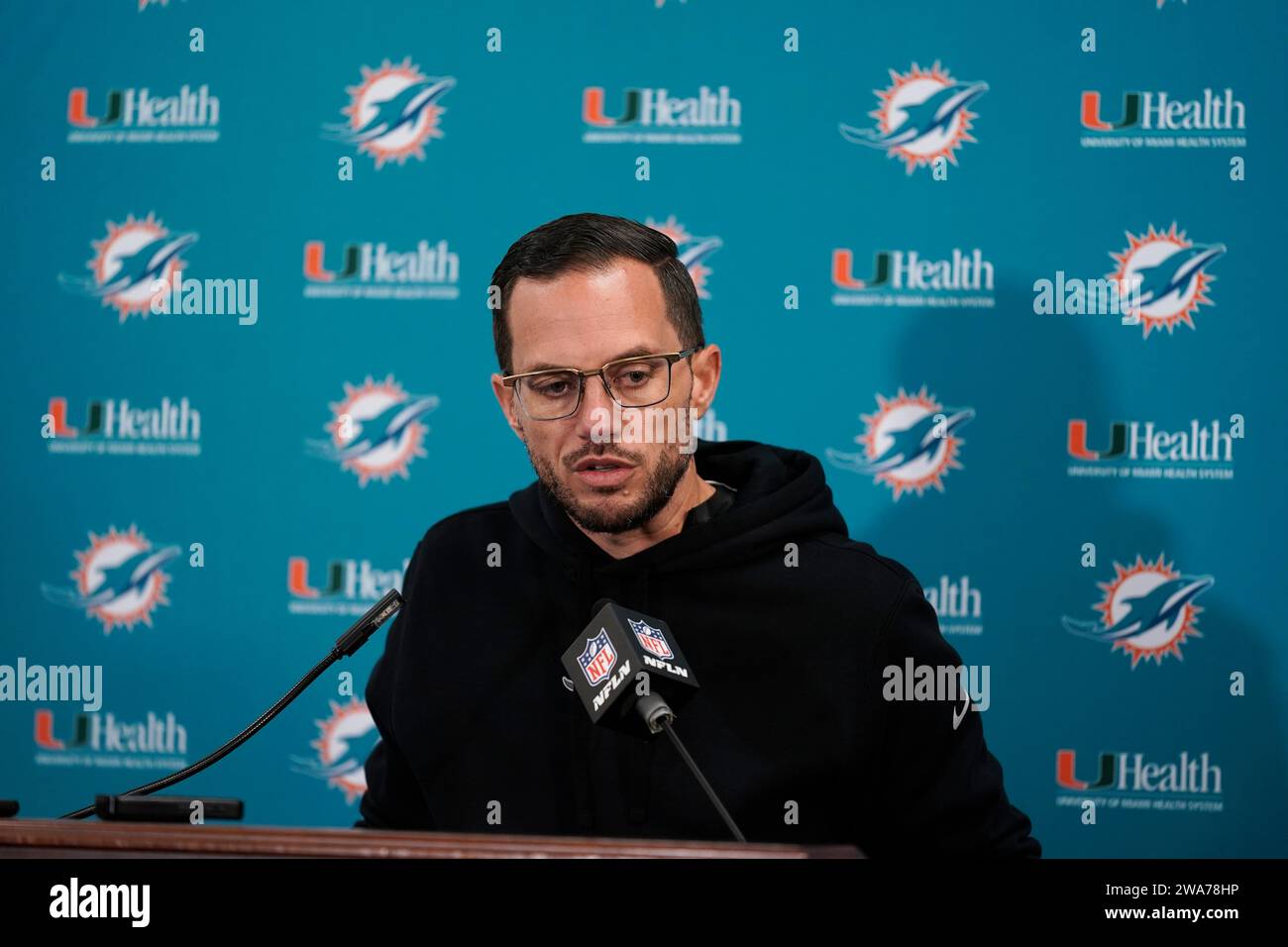 Miami Dolphins head coach Mike McDaniel speaks with members of the ...