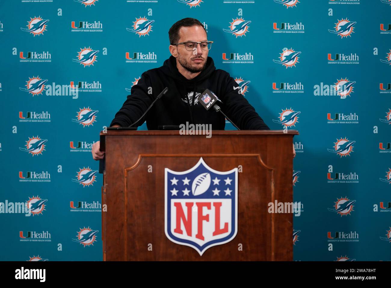 Miami Dolphins head coach Mike McDaniel speaks with members of the ...