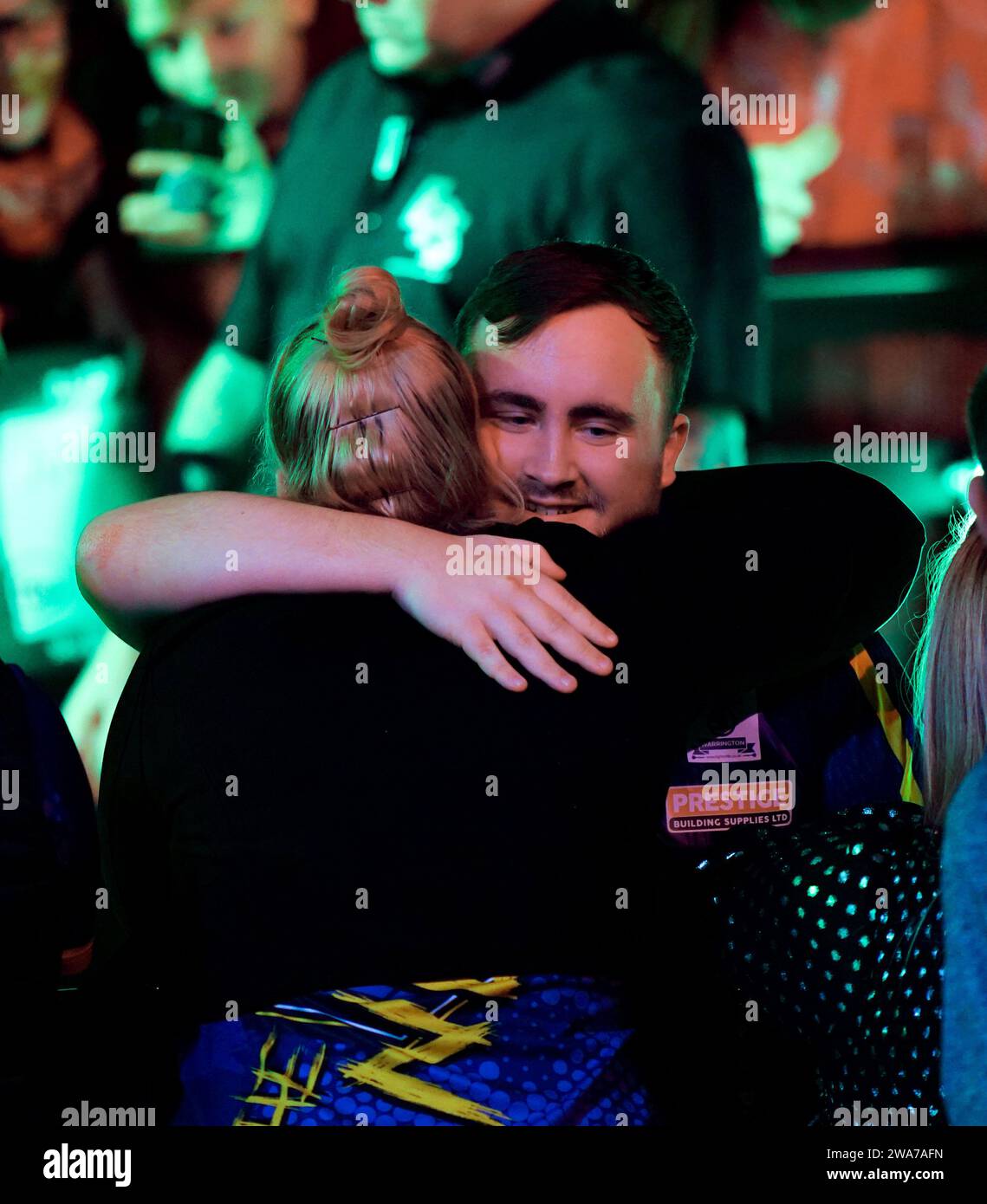 Luke Littler greets family and friends before his match against Rob ...