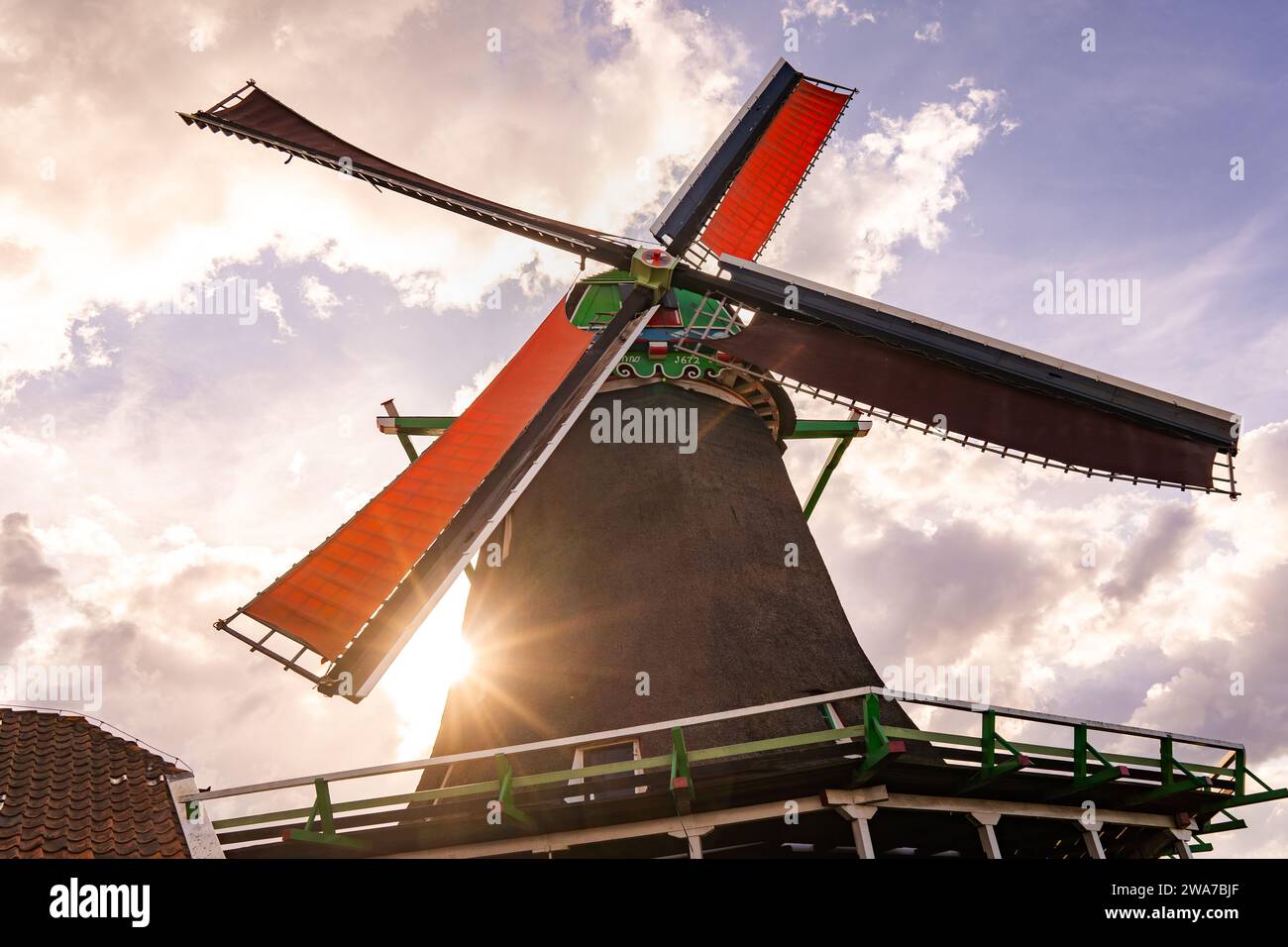 traditional windmill against sunny background Stock Photo - Alamy