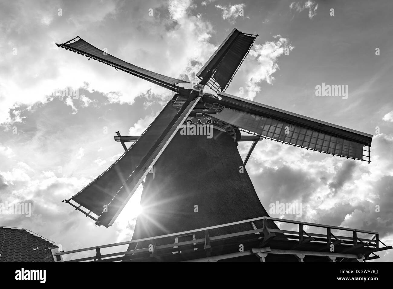 traditional windmill against sunny background in black and white Stock ...