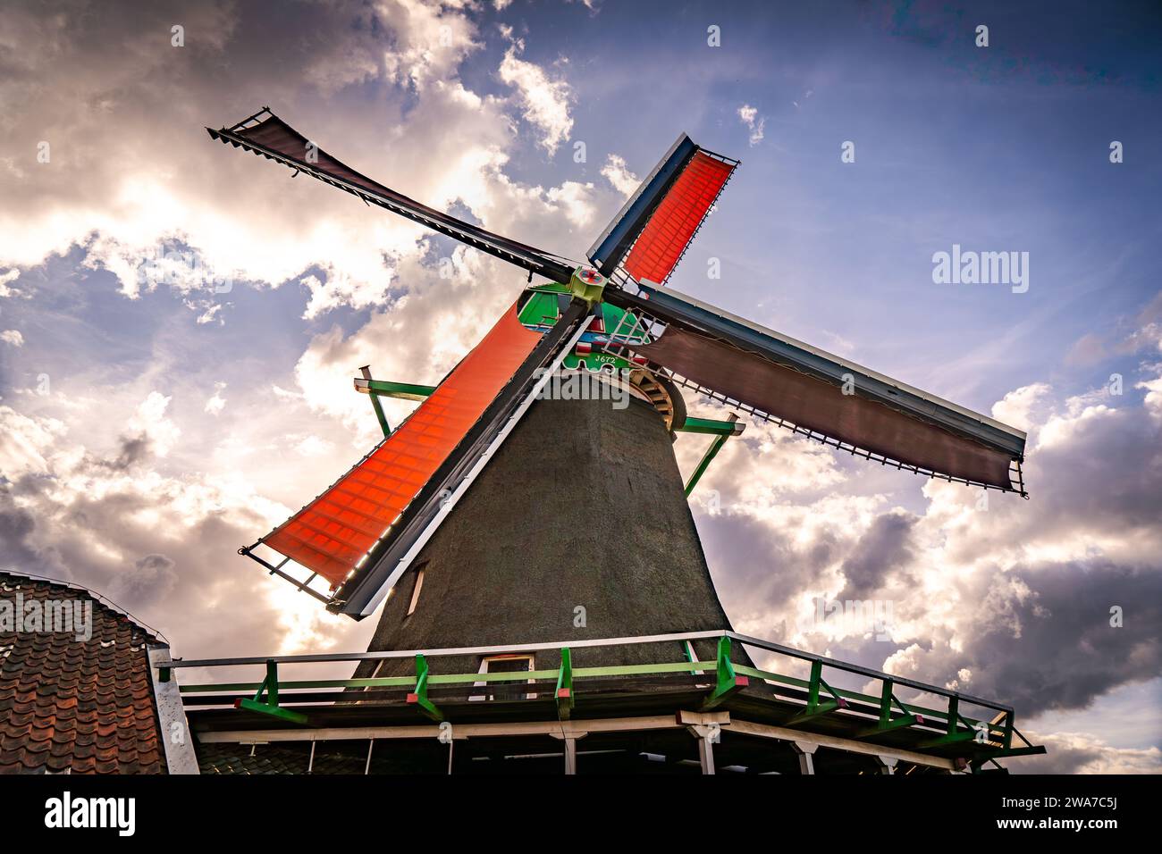 traditional dutch windmill during colorful sunset Stock Photo - Alamy