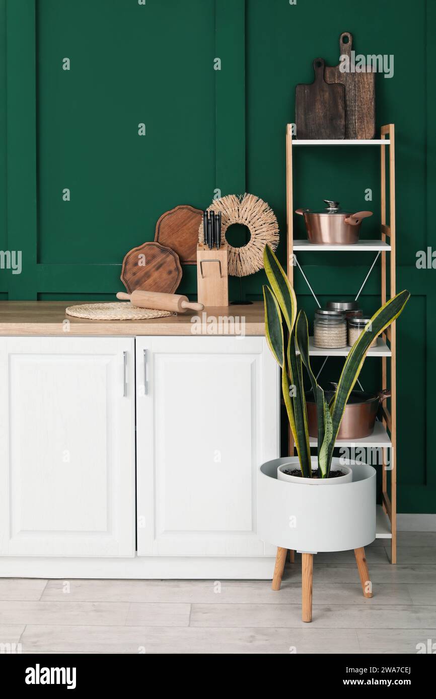 Interior of modern kitchen with white counters and shelving unit Stock ...