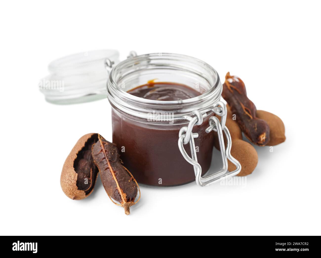 Jar with tasty tamarind jam with fruits on white background Stock Photo ...