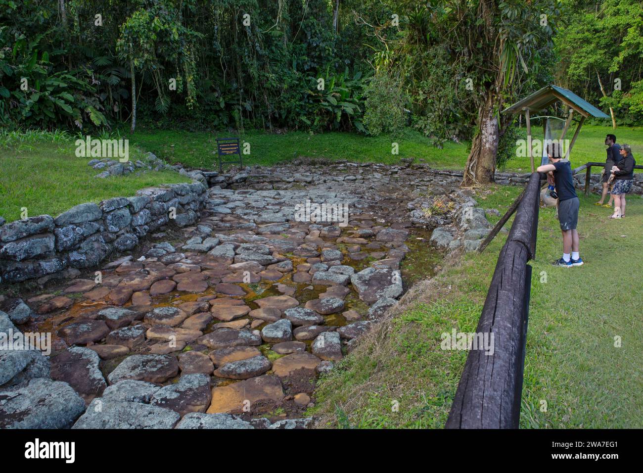 Tourist at indigenous aqueduct settler, Guayabo National Monument ...