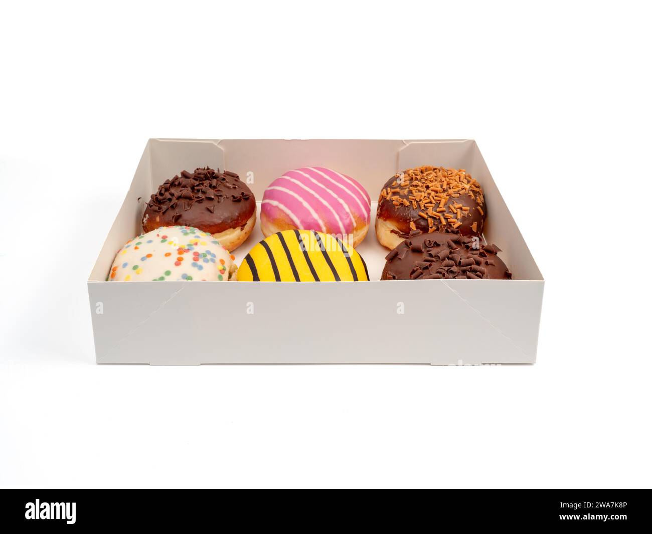 Cardboard box with donuts of different flavors isolated on a white ...