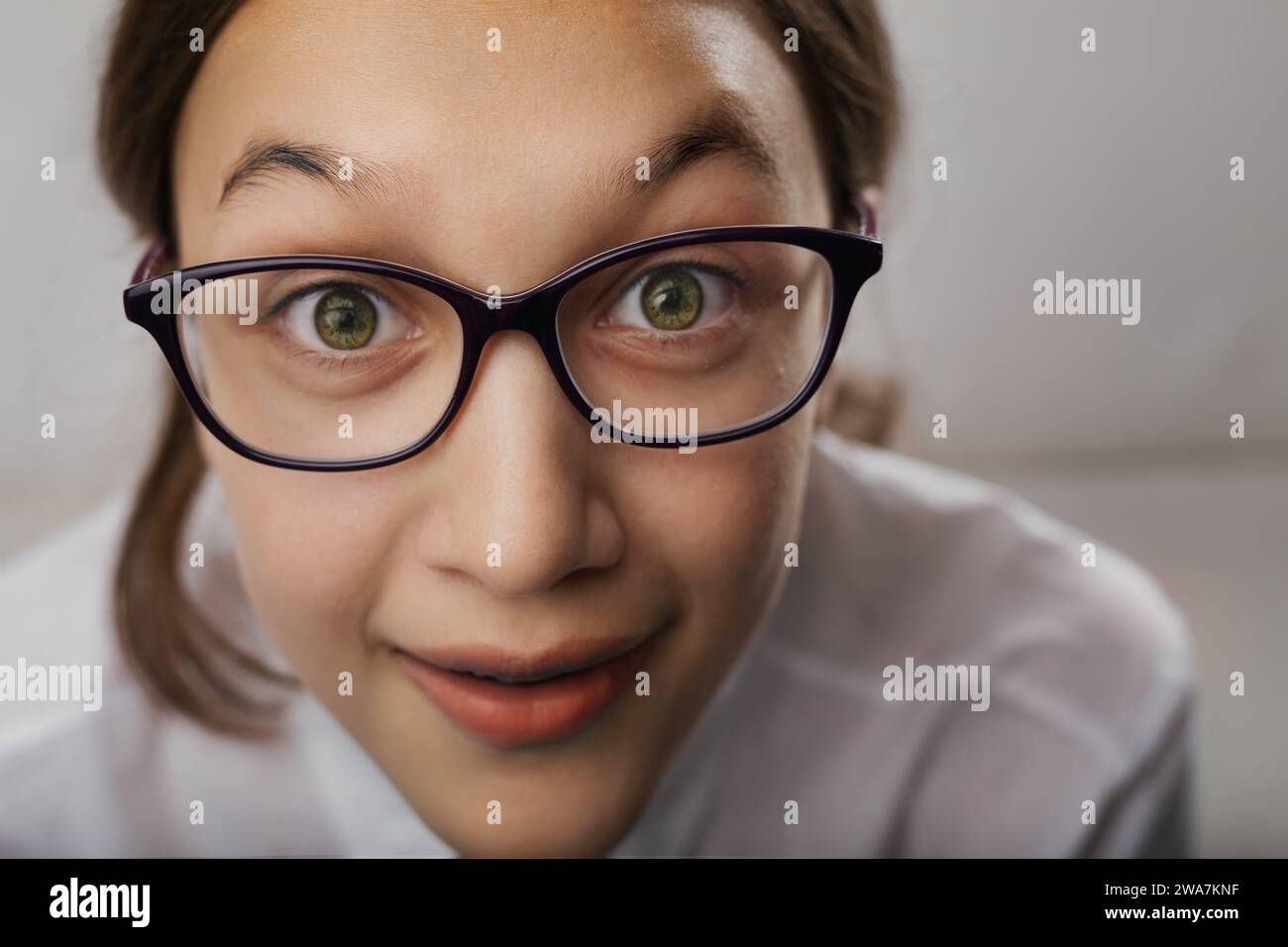Her magnified gaze captures the essence of innocent inquisitiveness, a ...