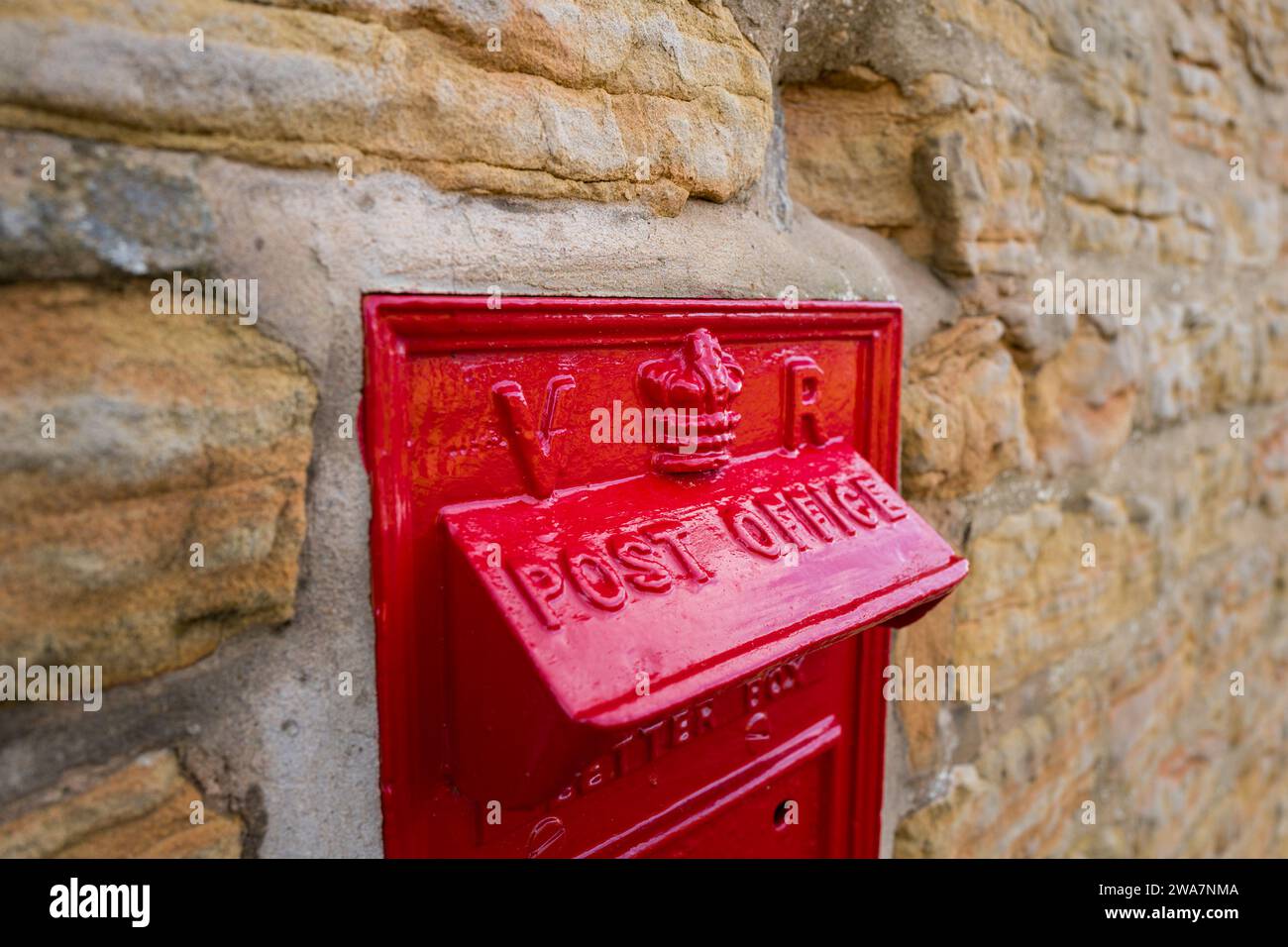 Queen Victoria, victorian red letter box mounted into a stone wall ...