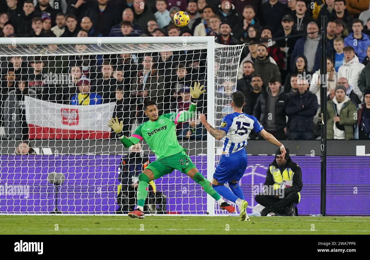 Brighton and Hove Albion's Jakub Moder (right) shoots over the goal as ...