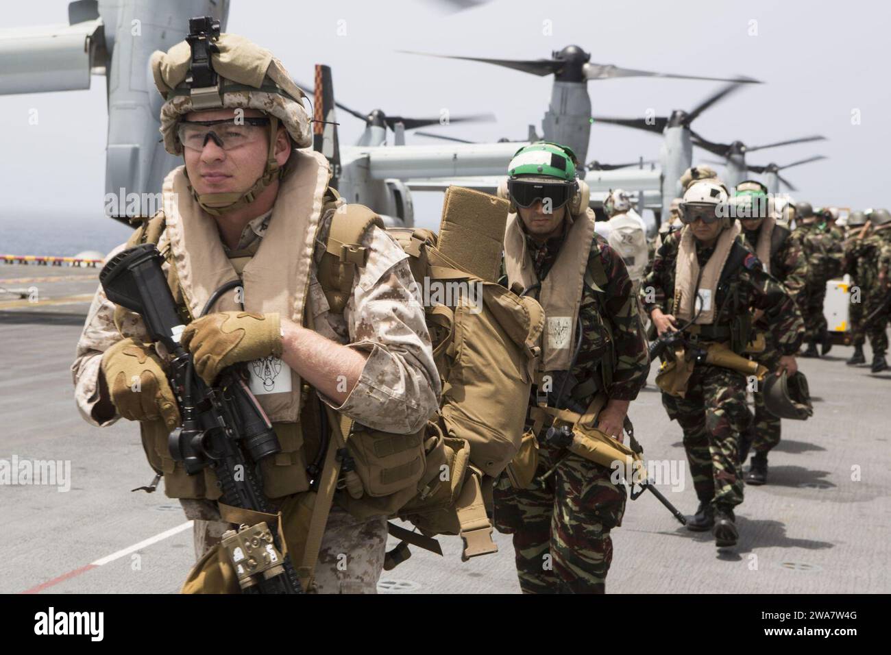 US military forces. U.S. Marines and Moroccan forces load onto a MV-22B ...