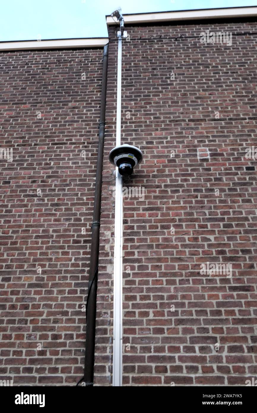 Safetysurveillance camera outside on the wall of a house. Equipment for ...