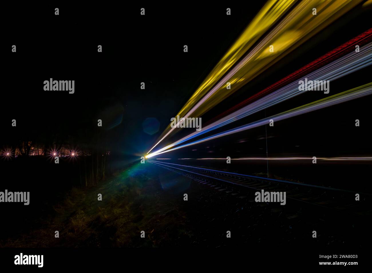 Color train railway light lines in dark night in south Bohemia near ...
