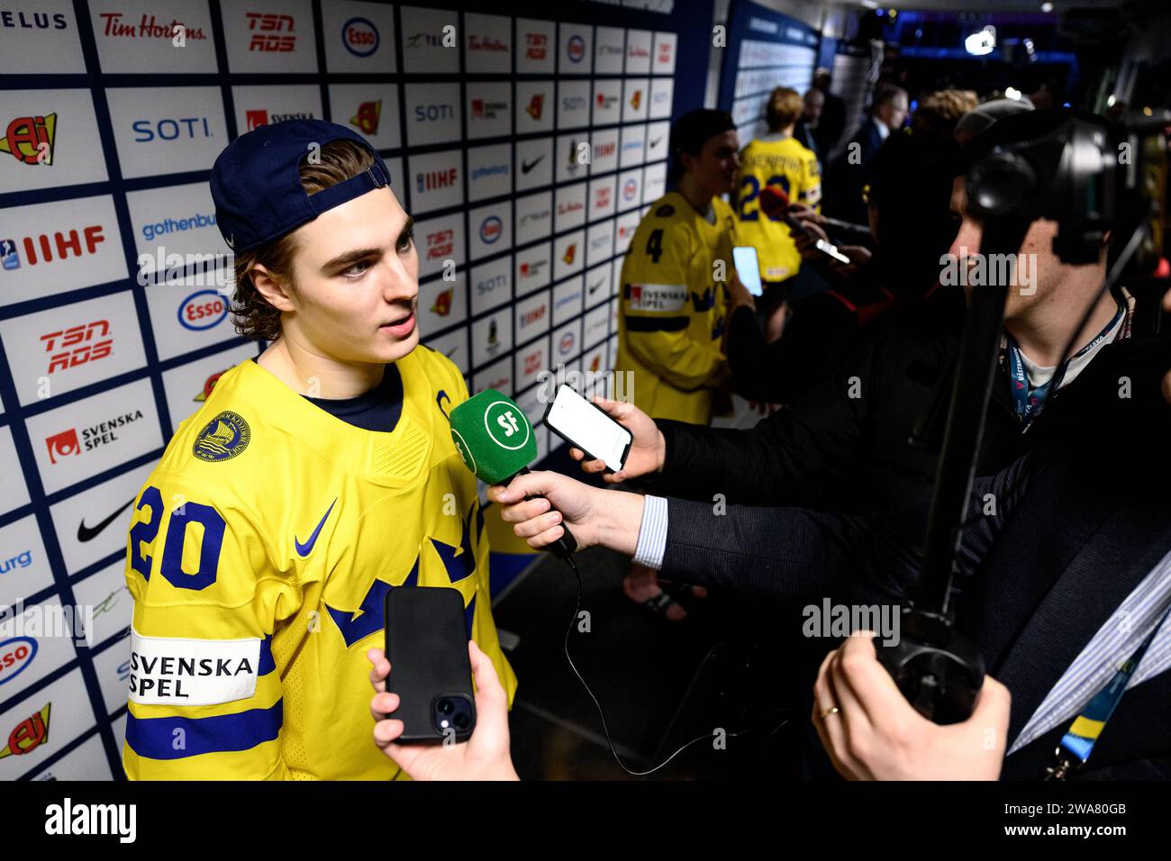 Liam Öhgren of, Sweden. , . in the mixed zone after the 2024 IIHF World Junior Championship ...