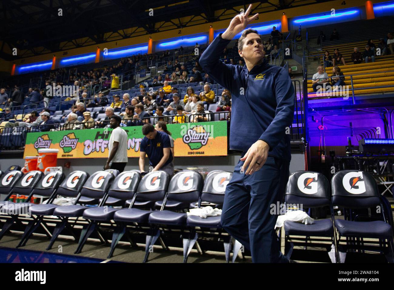 California head coach Mark Madsen waves to a fan in the stands before ...