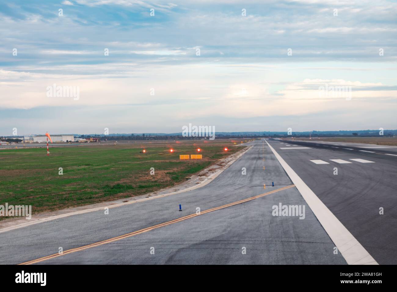 View of the runway in the airport with traffic lights Stock Photo - Alamy